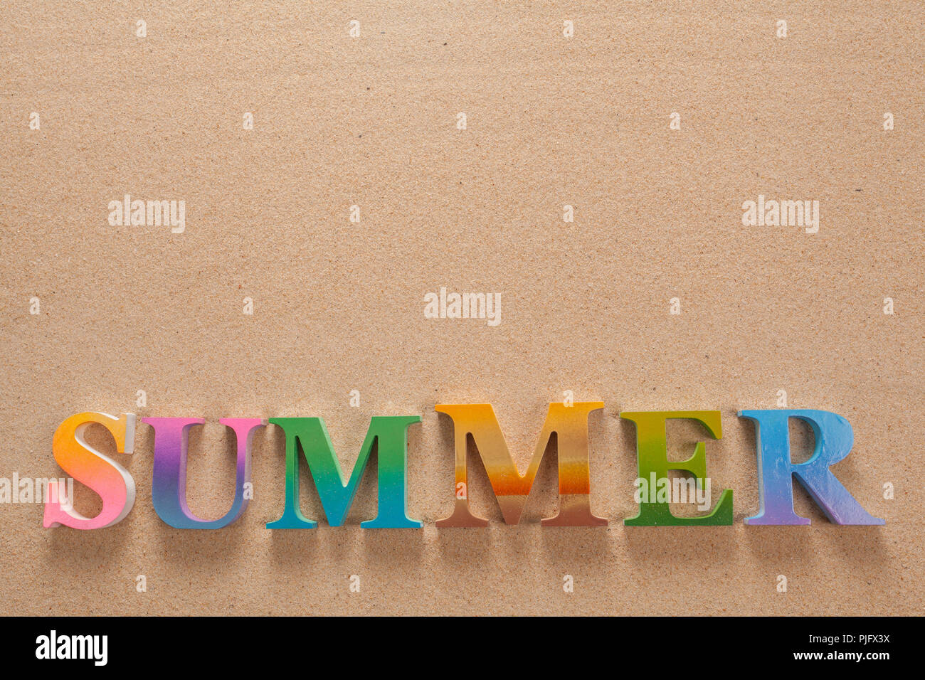 summer written in colorful letters on the beach with copy space Stock ...