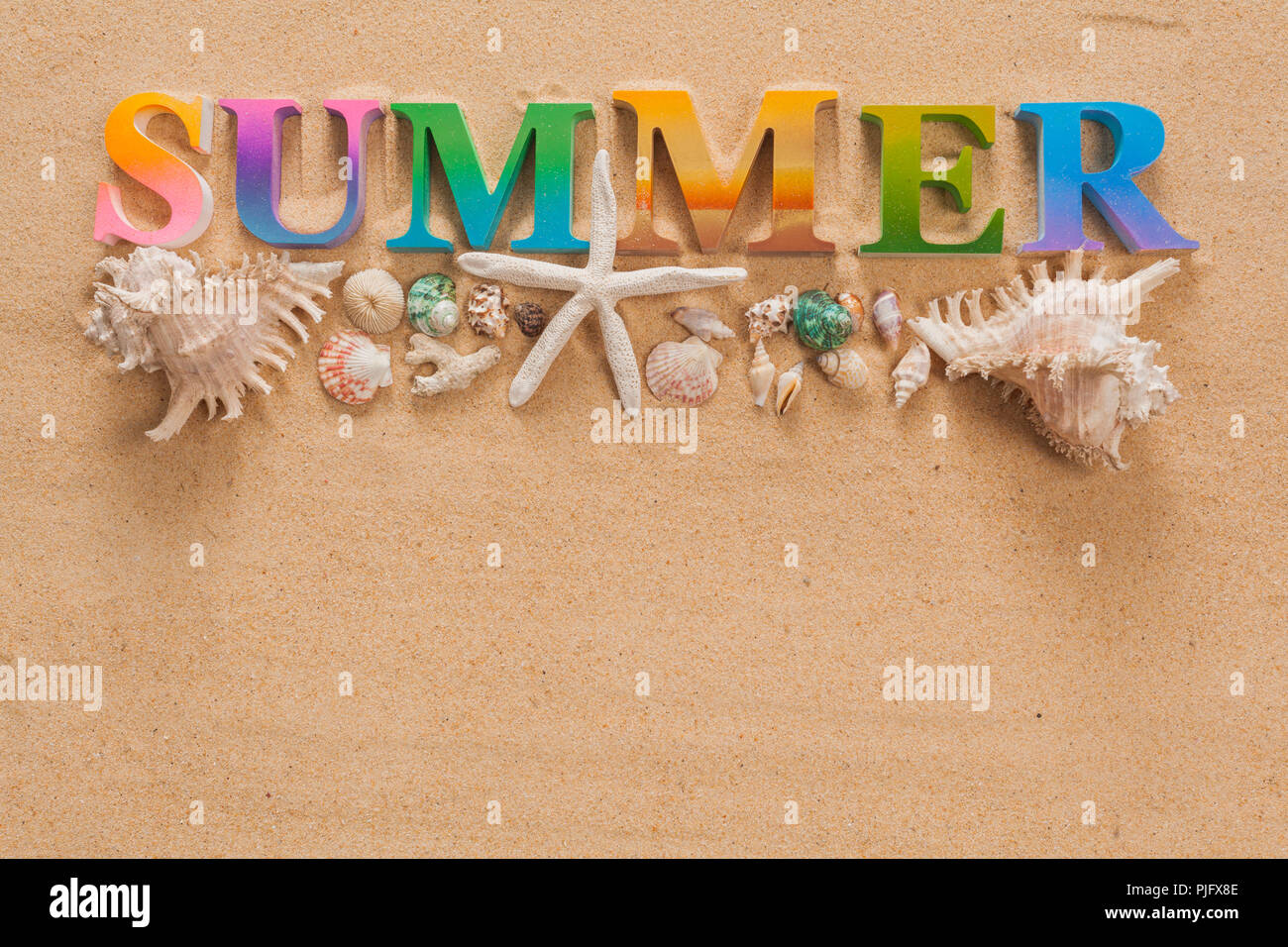 summer written in colorful letters decorate with starfish on the beach ...