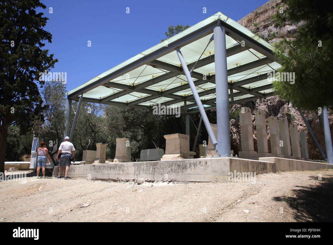 Acropolis Athens Greece Tourists looking at Ancient Columns under a ...