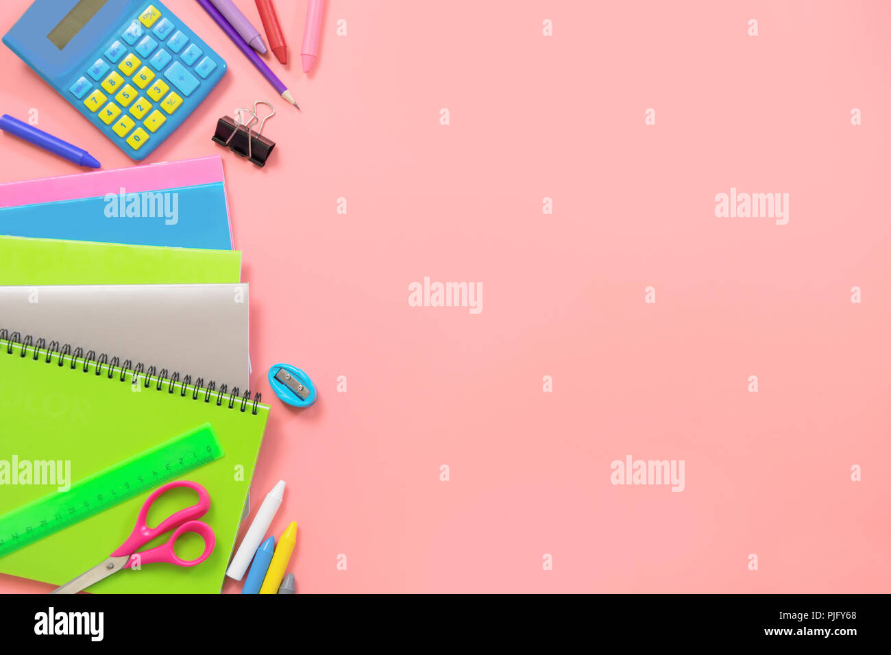 Colorful school supplies on pastel pink background. Top view, flat lay ...
