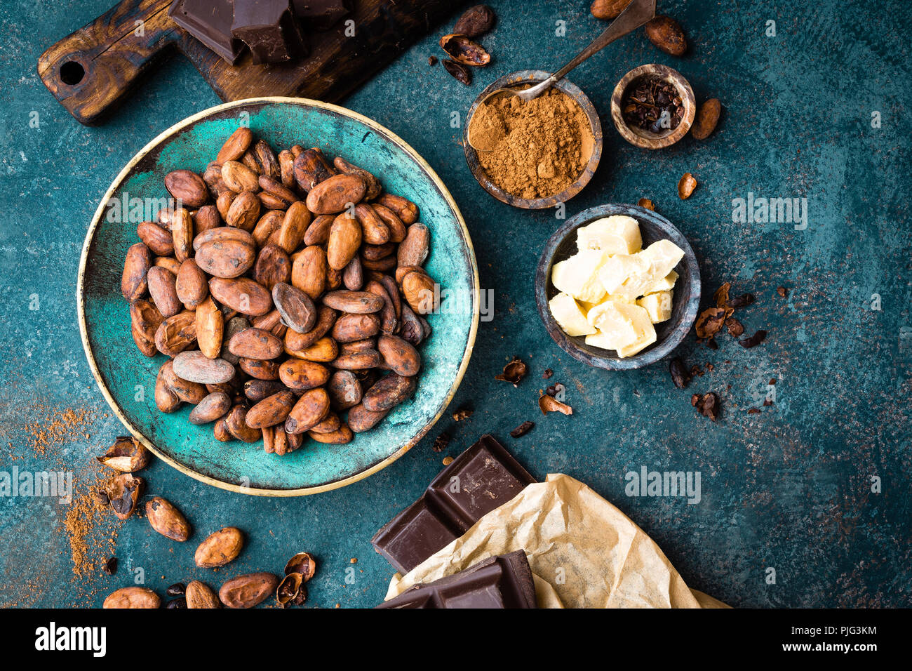 Cocoa. Cocoa beans, dark bitter chocolate chunks, cacao butter and ...