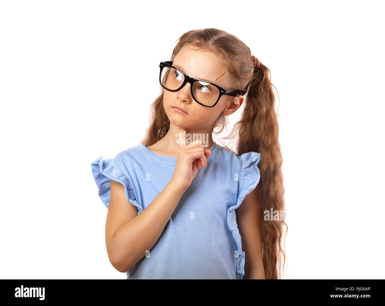 Fun serious girl in eye glasses thinking and looking up isolated on ...