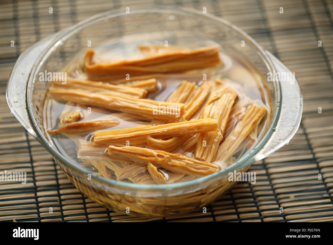 Rehydration of dried yuba sticks, the soybean product also known as ...