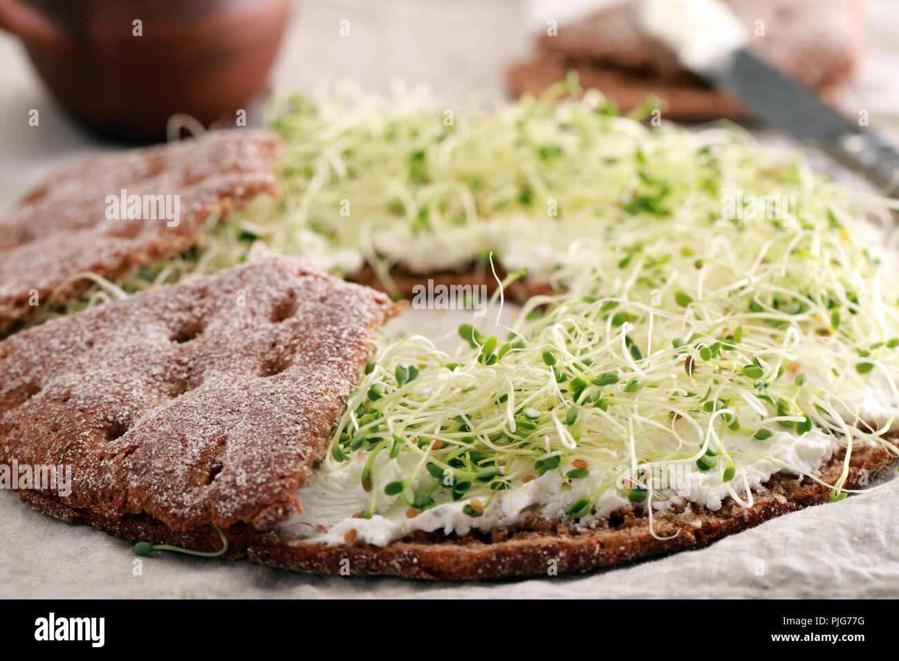 Finnish sandwich with cream cheese, cress, and round bread Reikaleipa ...