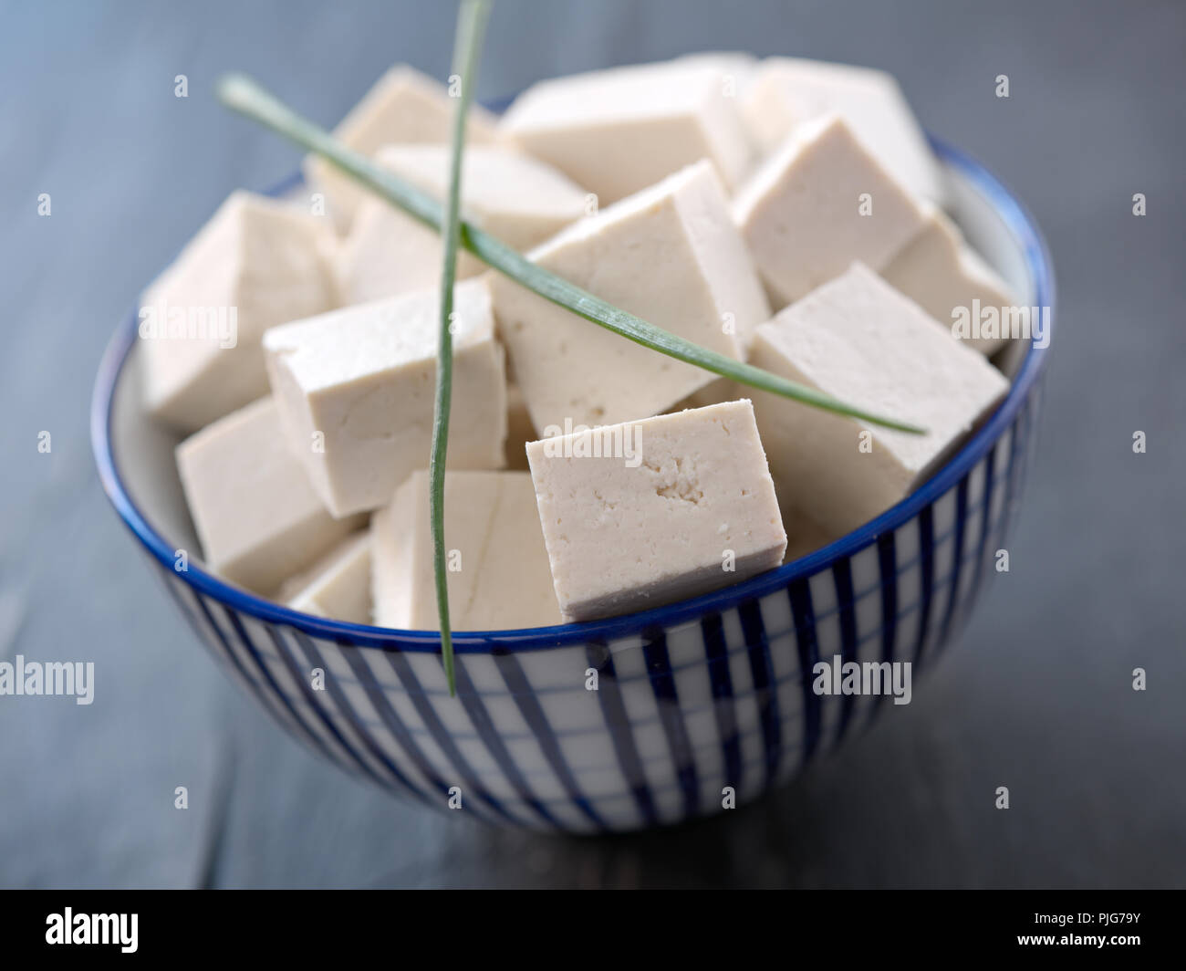 Diced tofu in a bowl Stock Photo - Alamy