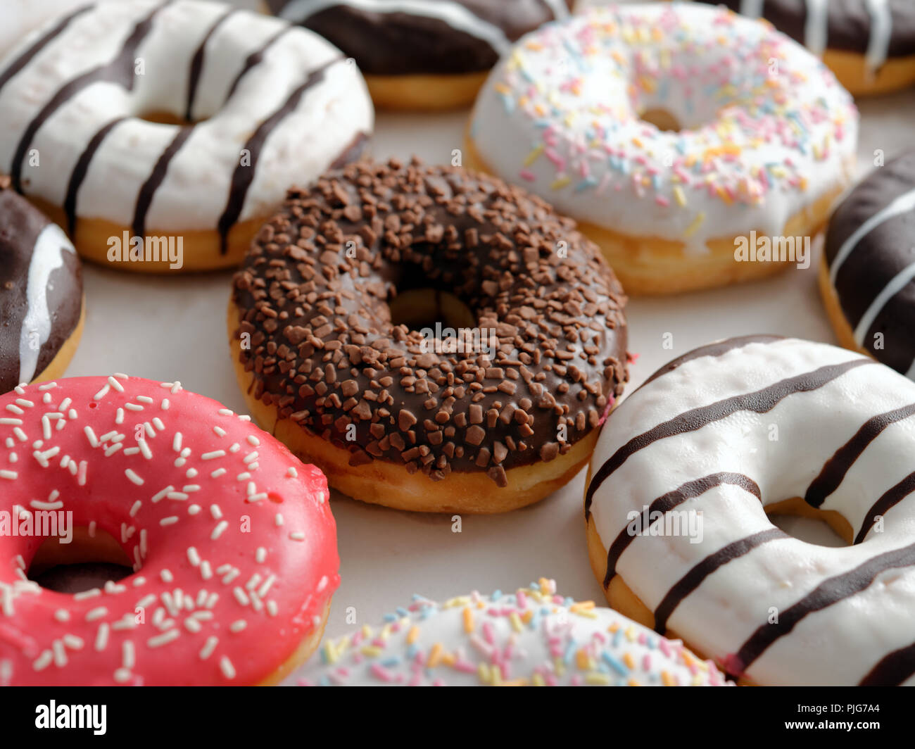 Assorted sweet donuts in a paper box Stock Photo - Alamy