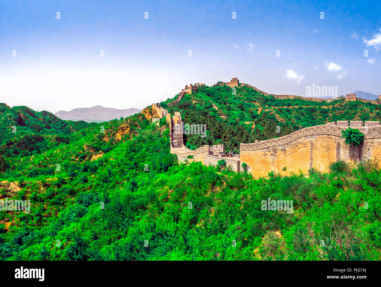 The Great Wall Jinshanling section with green trees in a sunny day ...