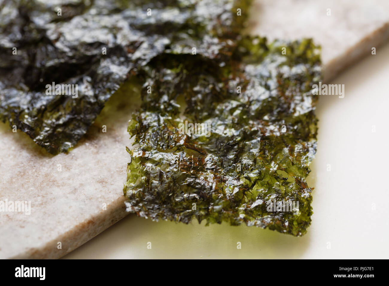 Nori sheets on a cutting board Stock Photo - Alamy