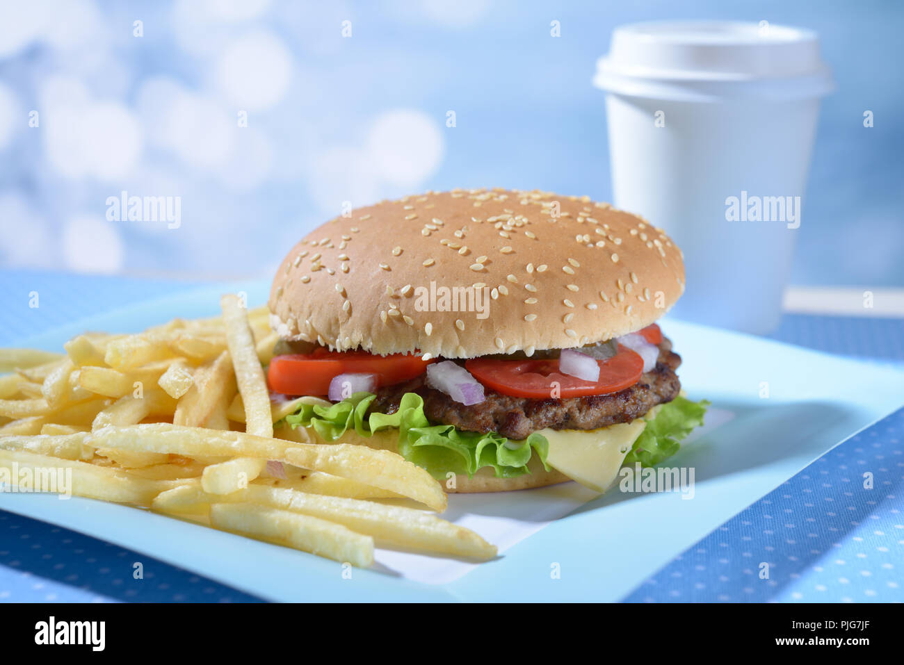 Hamburger and fried potato on a paper plate Stock Photo - Alamy