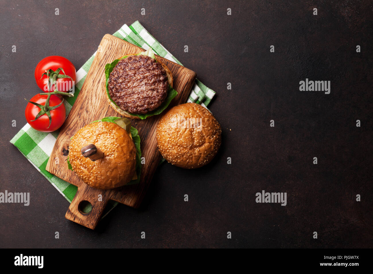 Tasty grilled home made burgers with beef, tomato, cheese, cucumber and ...