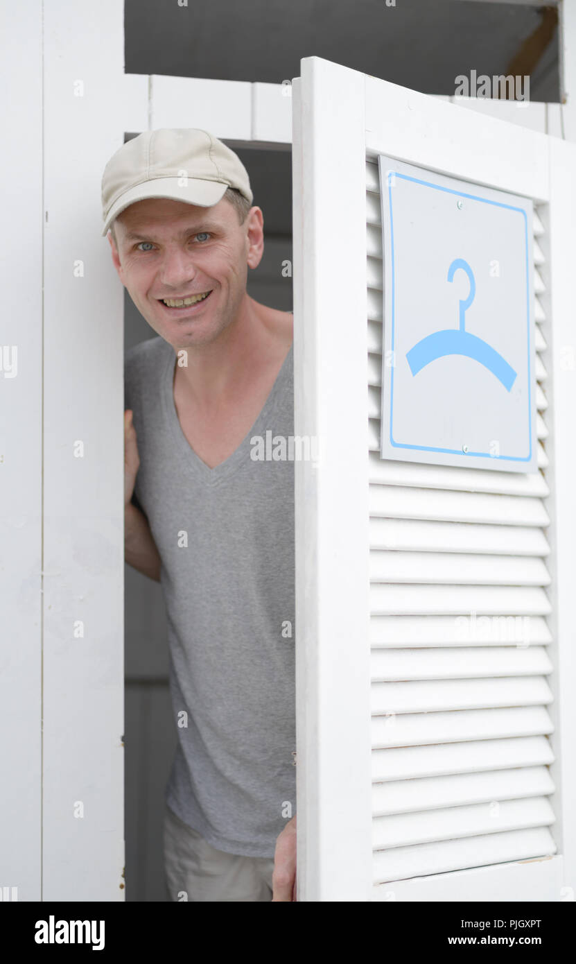 Man changing on a beach hi-res stock photography and images - Alamy