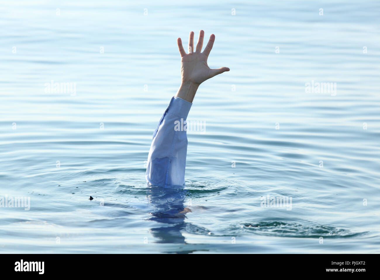 Businessman drowning in sea hi-res stock photography and images - Alamy