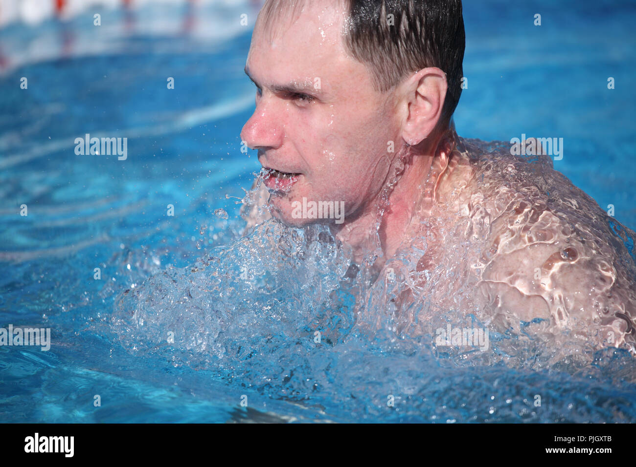 Man swimming in a swimming pool Stock Photo - Alamy