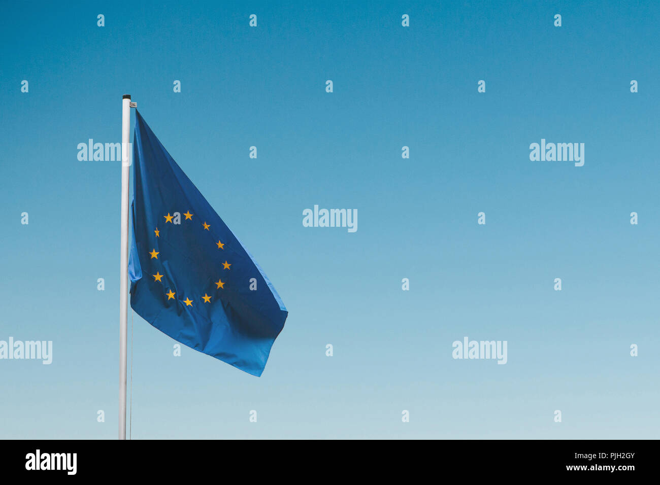 Flag of the European Union on the flagpole against the sky Stock Photo ...