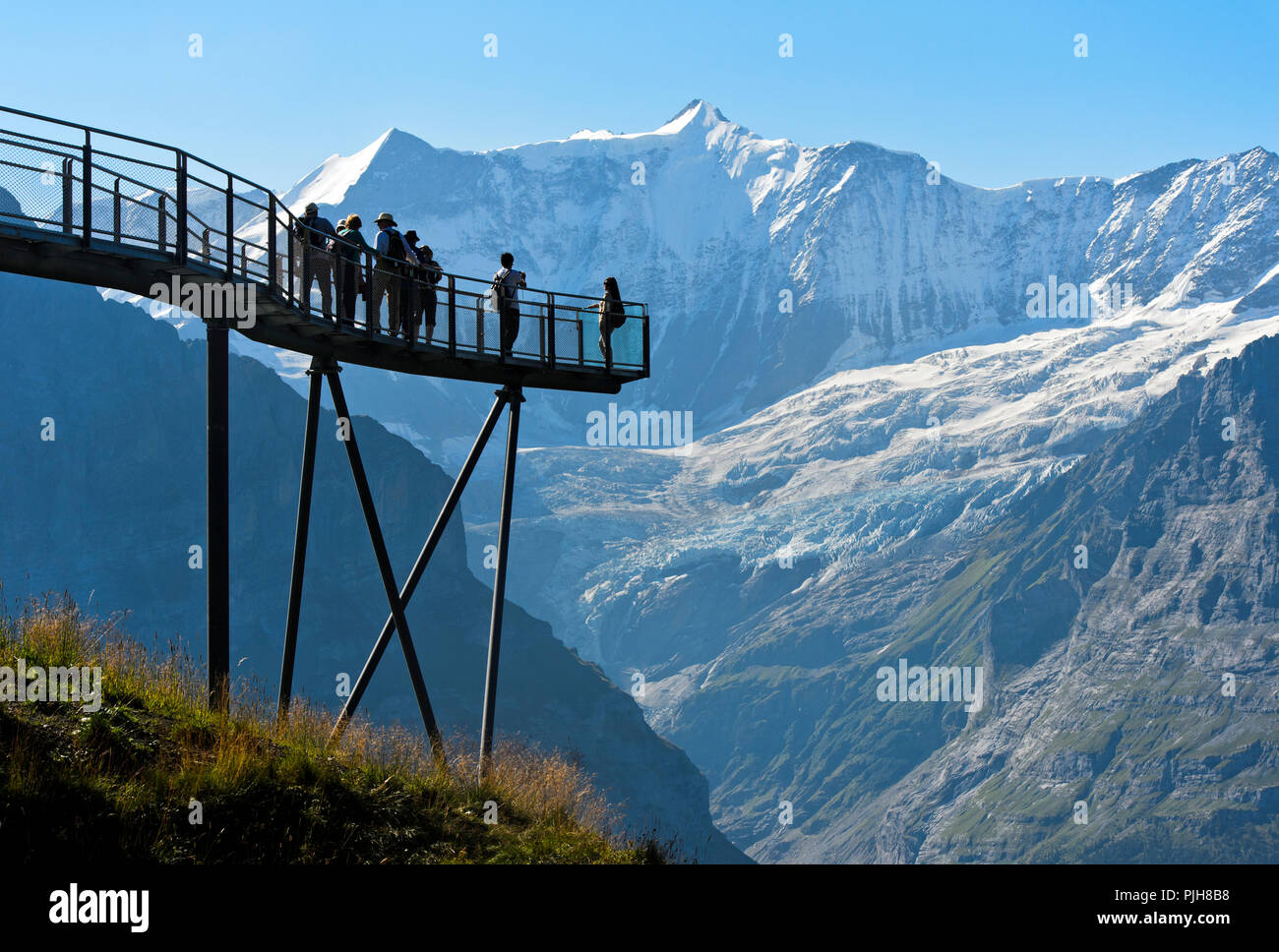 Tourists on the observation deck of the First Cliff Walk by Tissot in ...