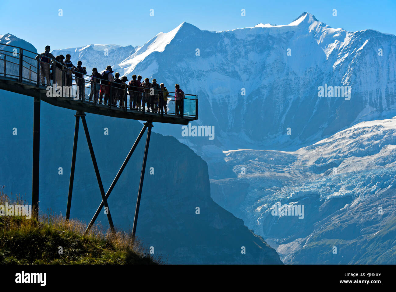Tourists on the observation deck of the First Cliff Walk by Tissot in ...