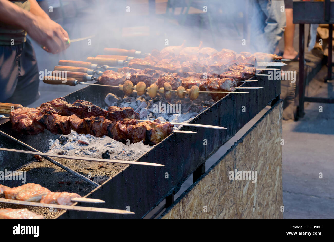 Street food and outdoor cooking concept. Vegetables, meat, cheese ...