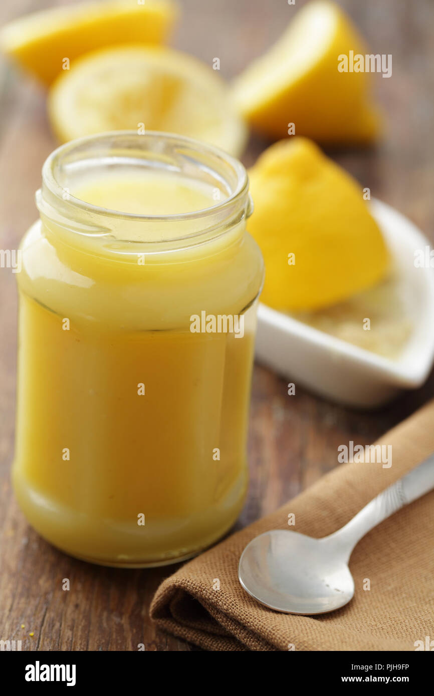 Lemon curd in the jar on the rustic table Stock Photo - Alamy