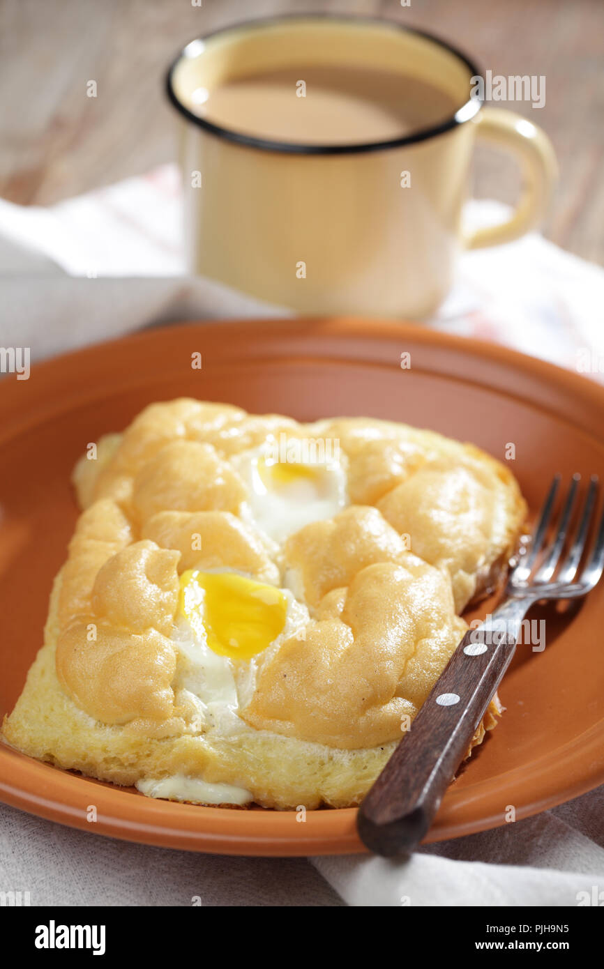 Rustic breakfast with slovakian style baked eggs and coffee Stock Photo ...