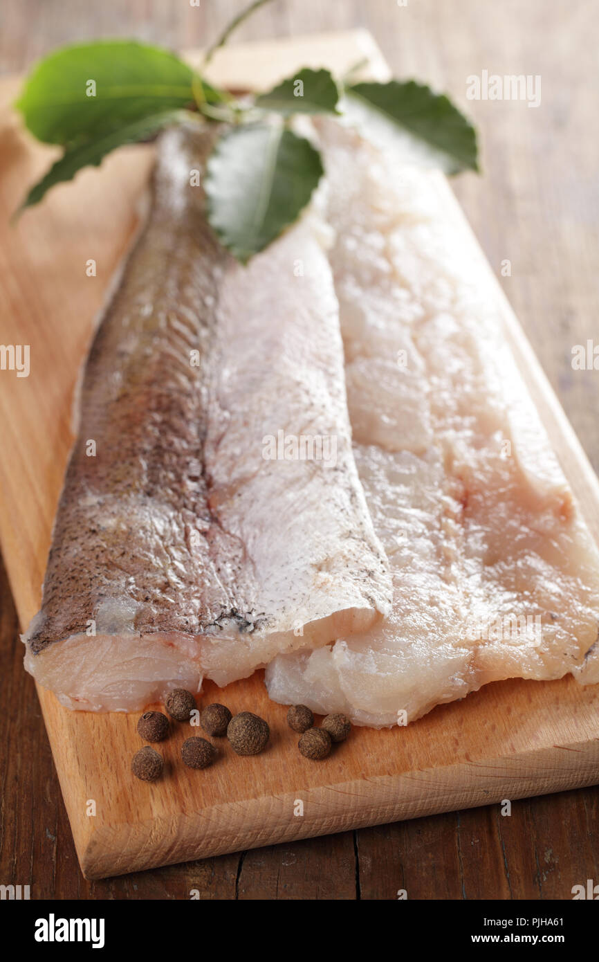 Raw fillet of hake on the cutting board with spices Stock Photo - Alamy