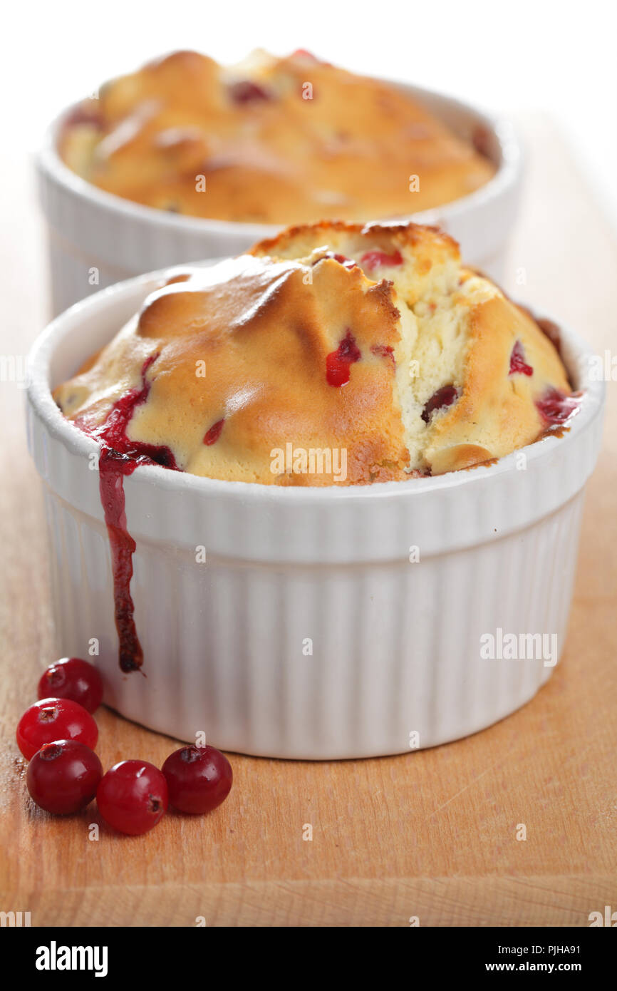 Two just baked cranberry muffins closeup Stock Photo - Alamy
