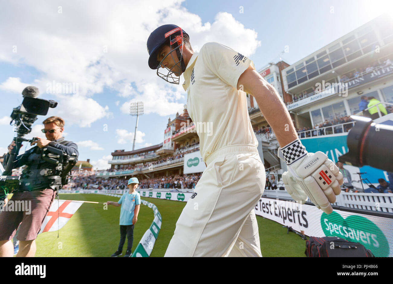 England's Alastair Cook walks onto the pitch for his last international ...