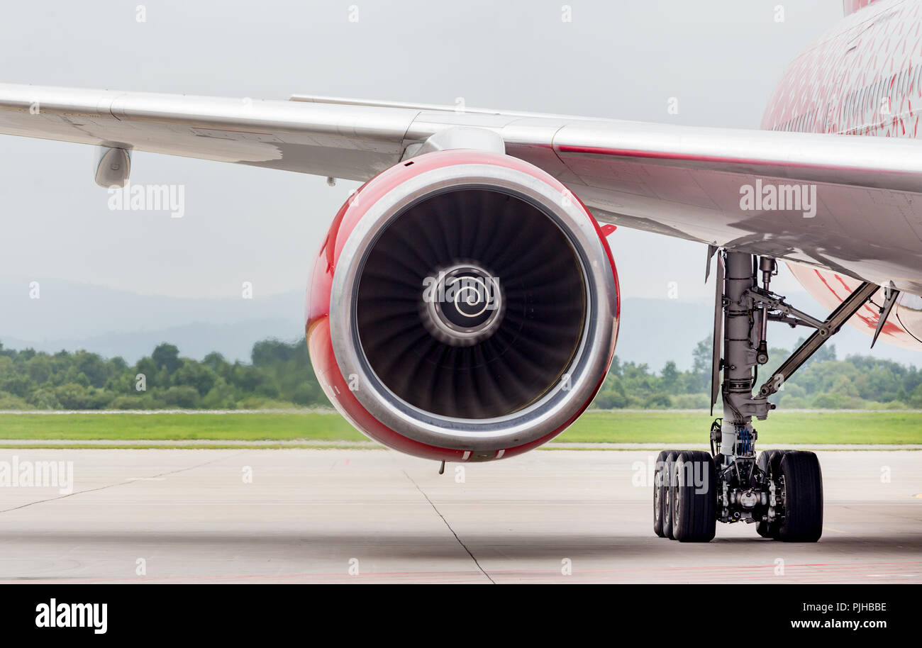 Turbine of airplane's engine under wing. Plane on runway. Service and ...