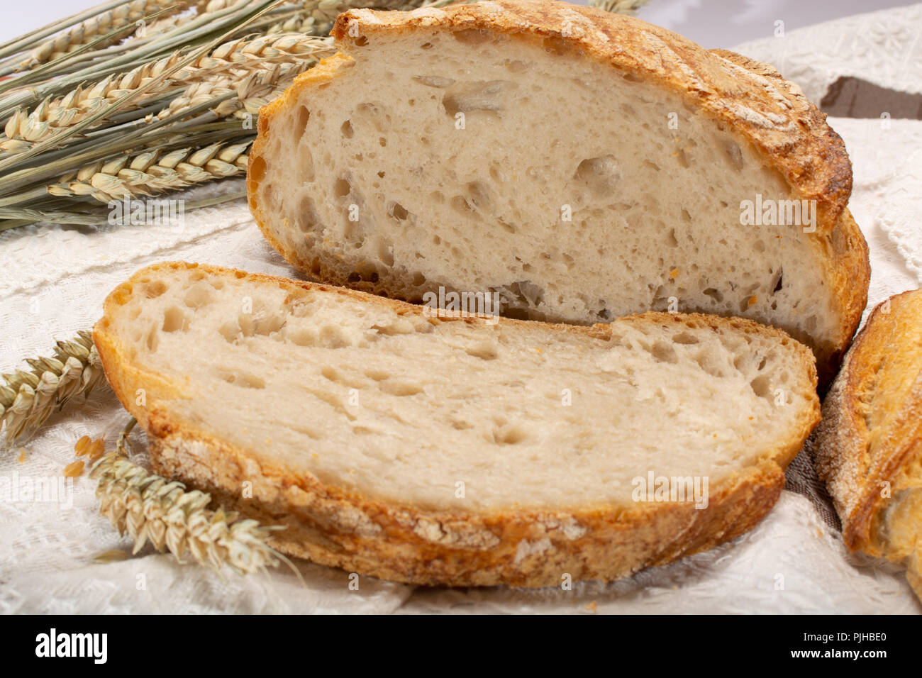 Sourdough homemade round white wheat bread with slices close up Stock ...