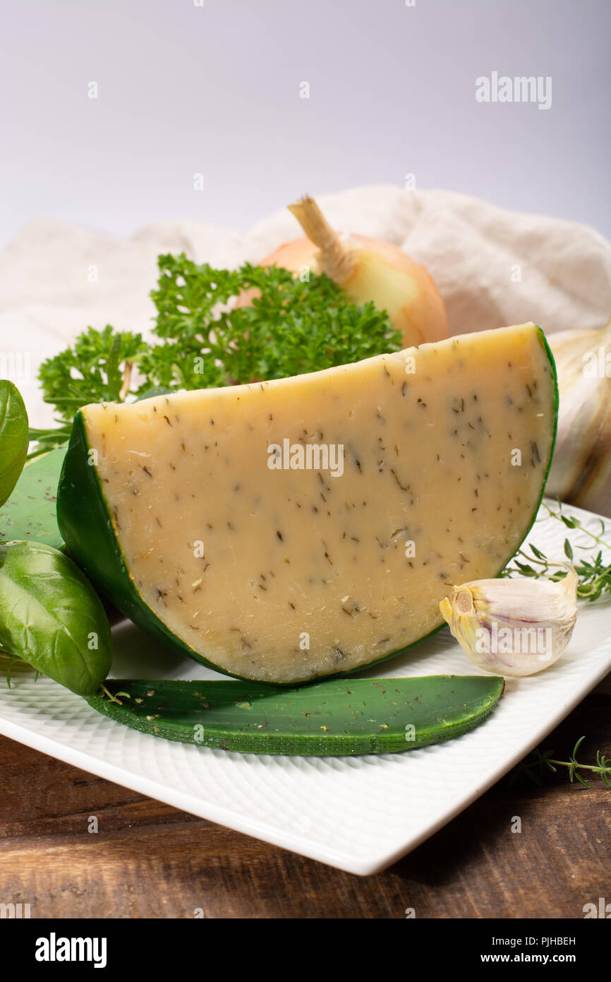 Dutch specialty hard cheese made from cows milk with different spices ...