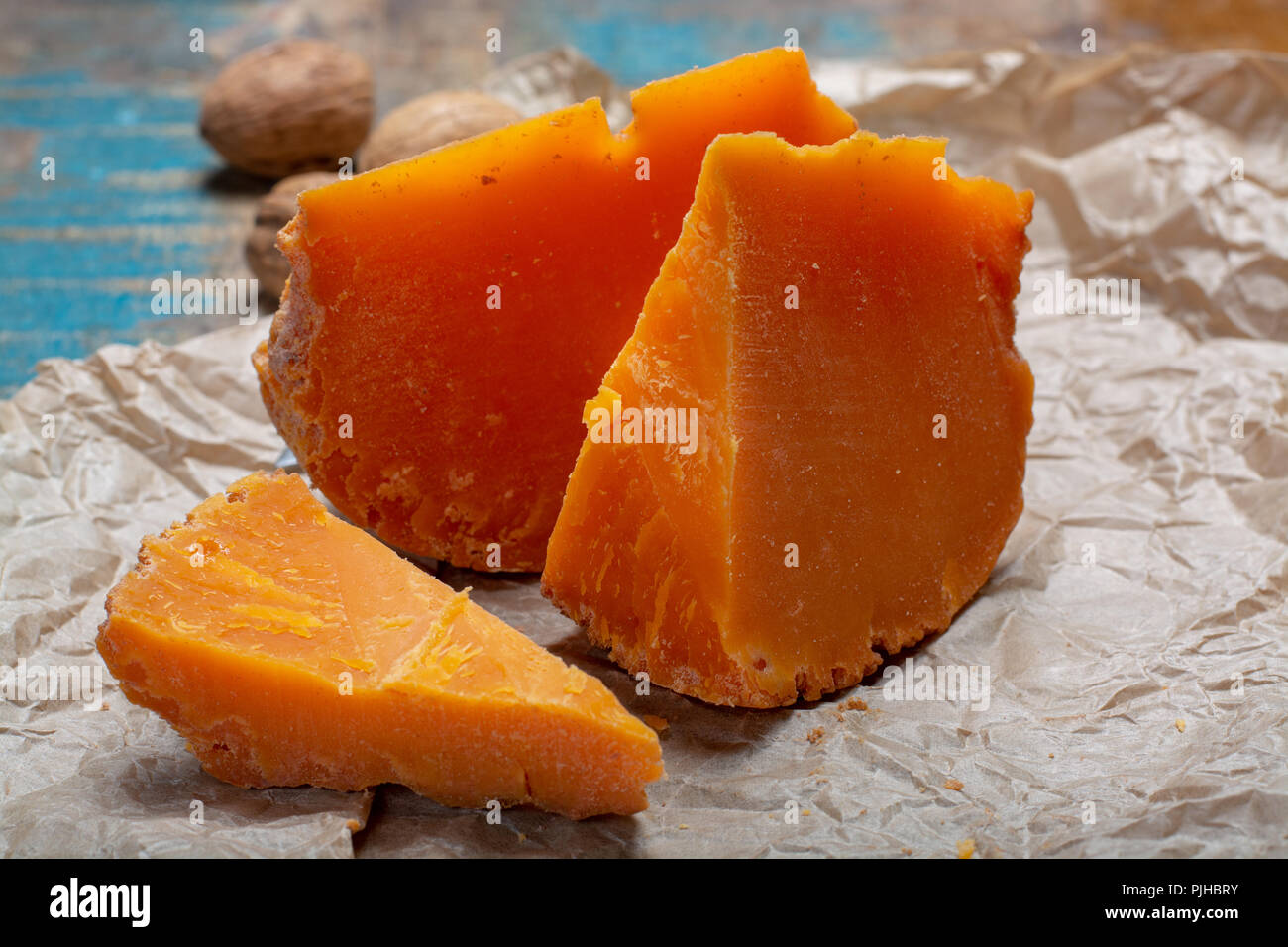 Pieces of native French aged cheese Mimolette, produced in Lille with ...