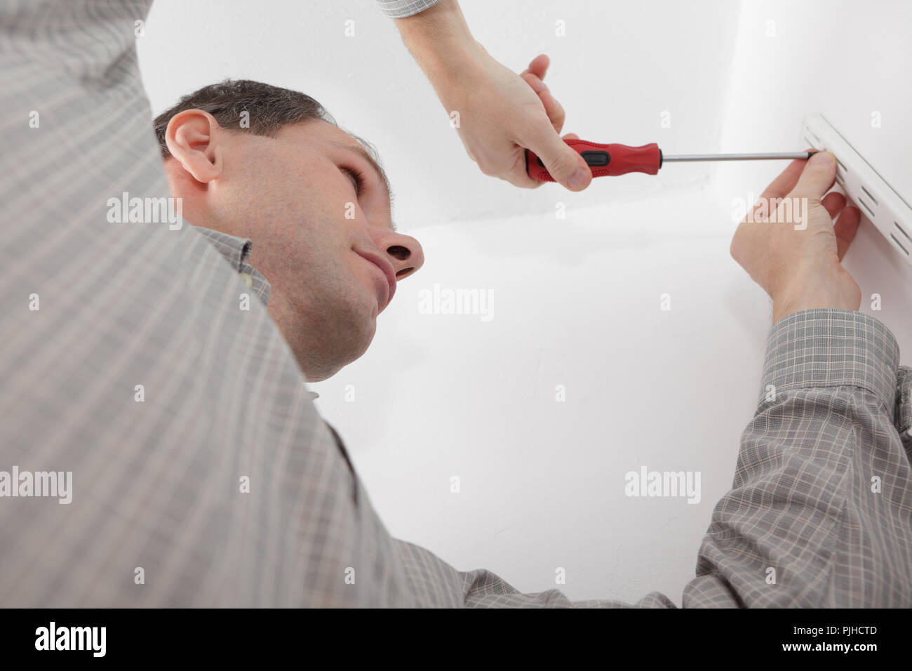 Worker twists in screw hi-res stock photography and images - Alamy