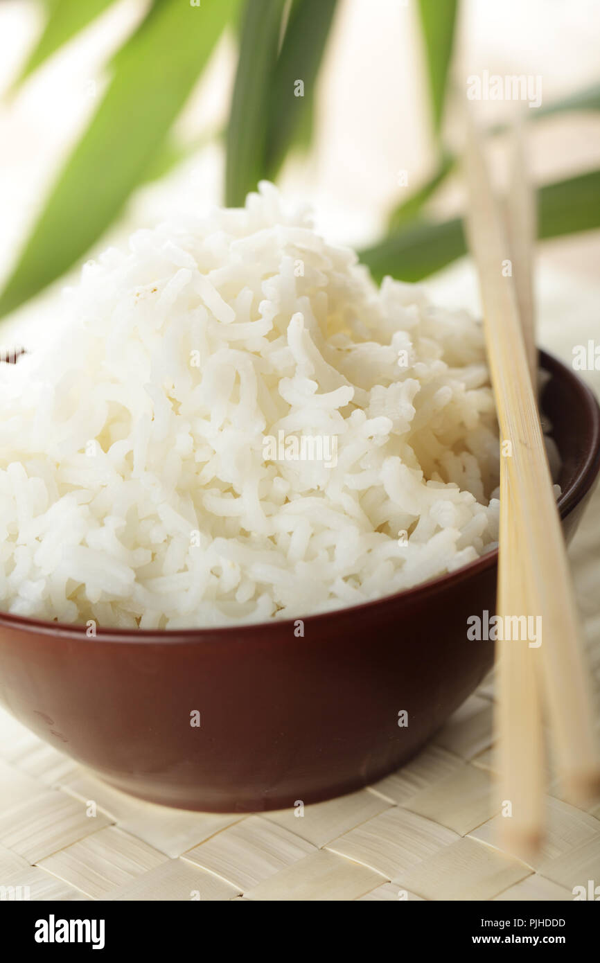 Bowl with prepared rice under bamboo branch Stock Photo - Alamy