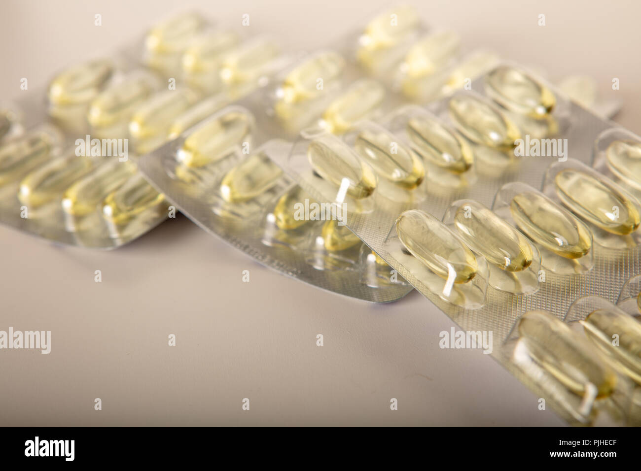 Yellow color fish oil pills softgels with omega 3 , epa and dha . Fish ...