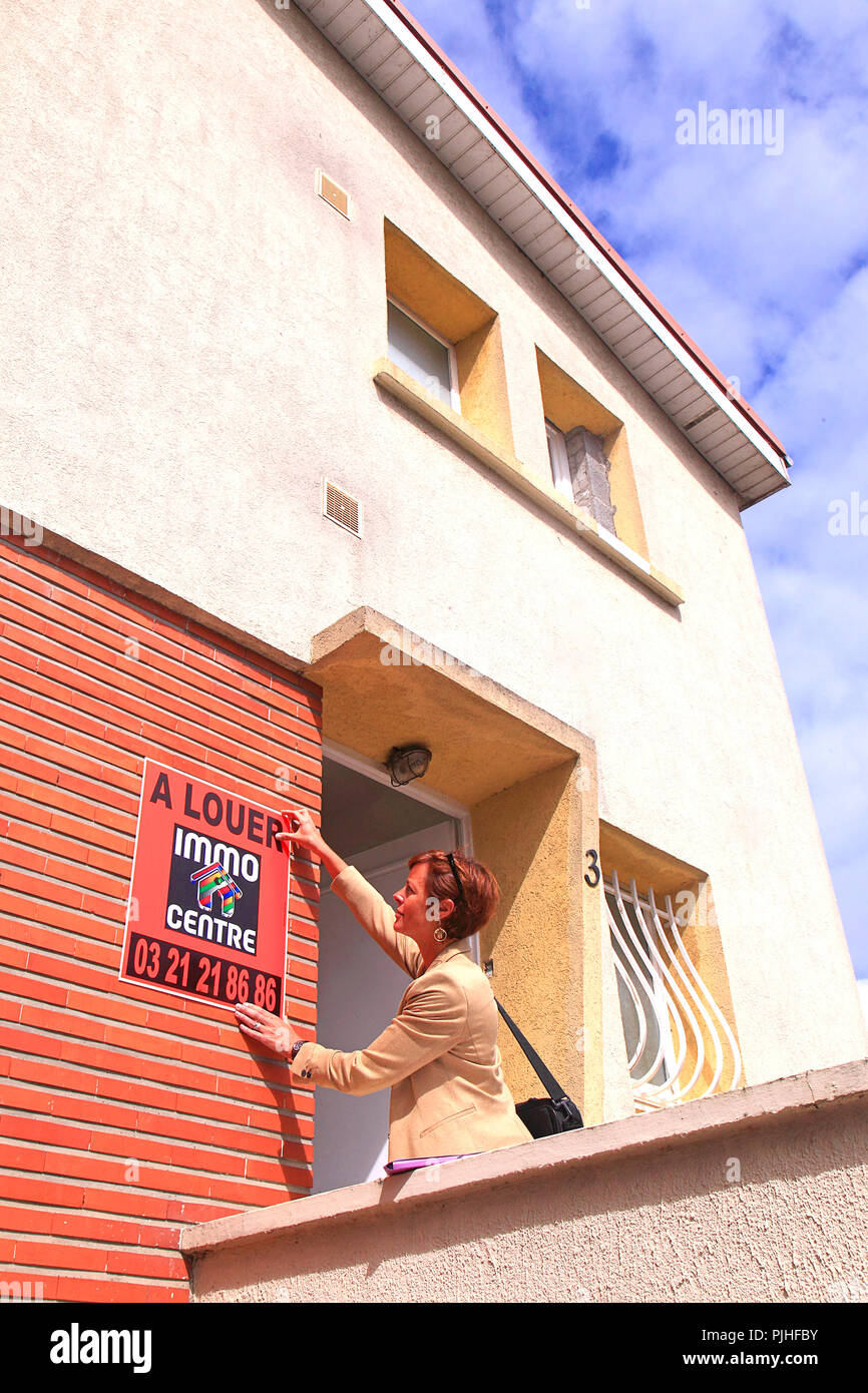 France, real estate agent posing advertisement on a housing Stock Photo ...