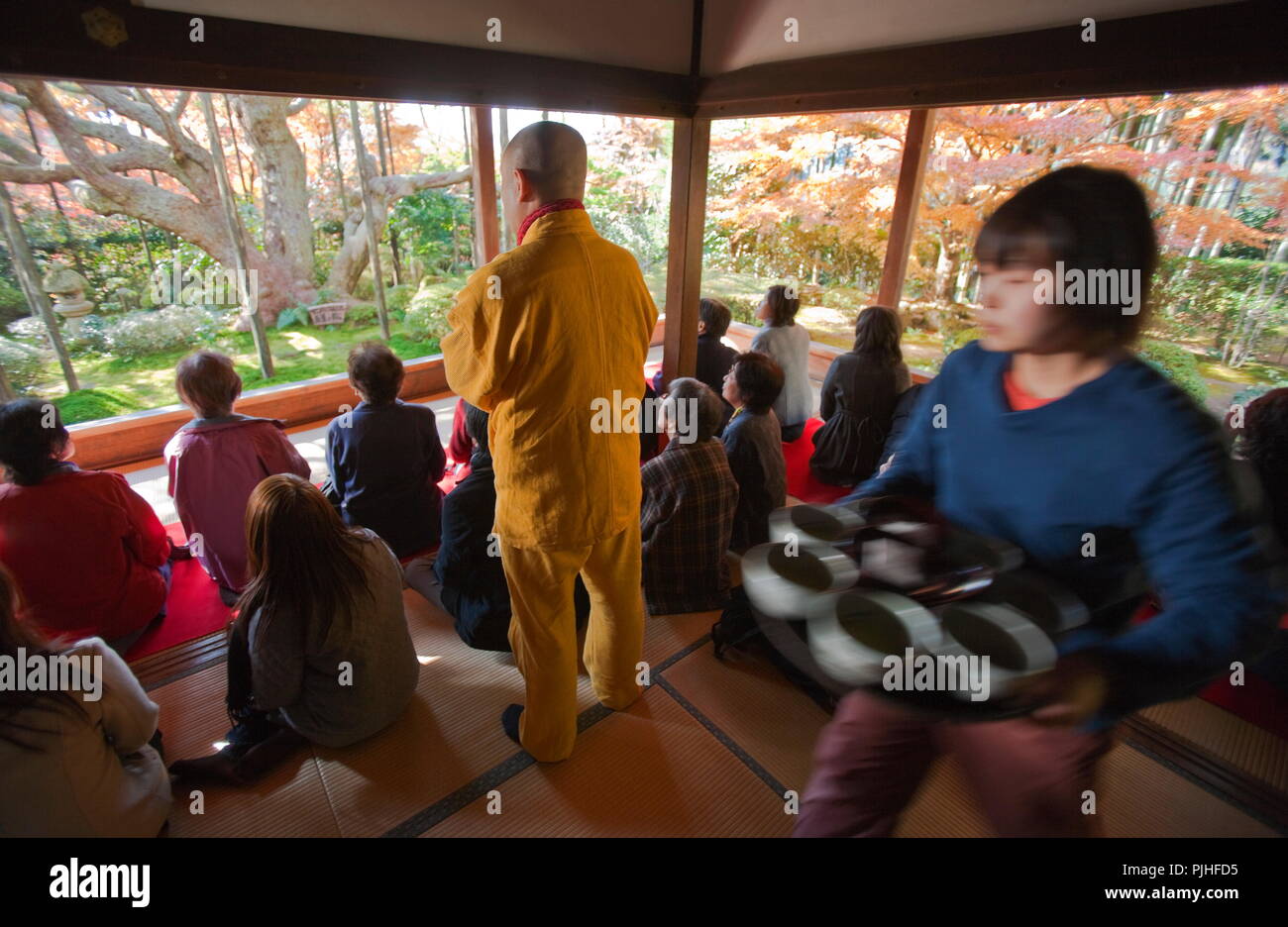 Japan, Ohara district, northeastern Kyoto, abbot greeting visitors with ...
