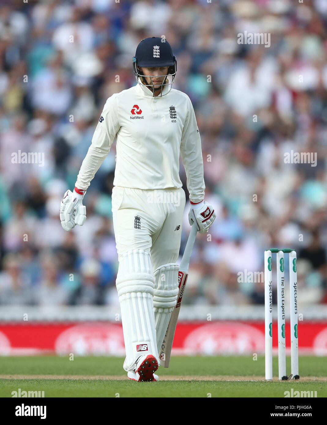 England's Joe Root looks dejected as he leaves the field after being ...