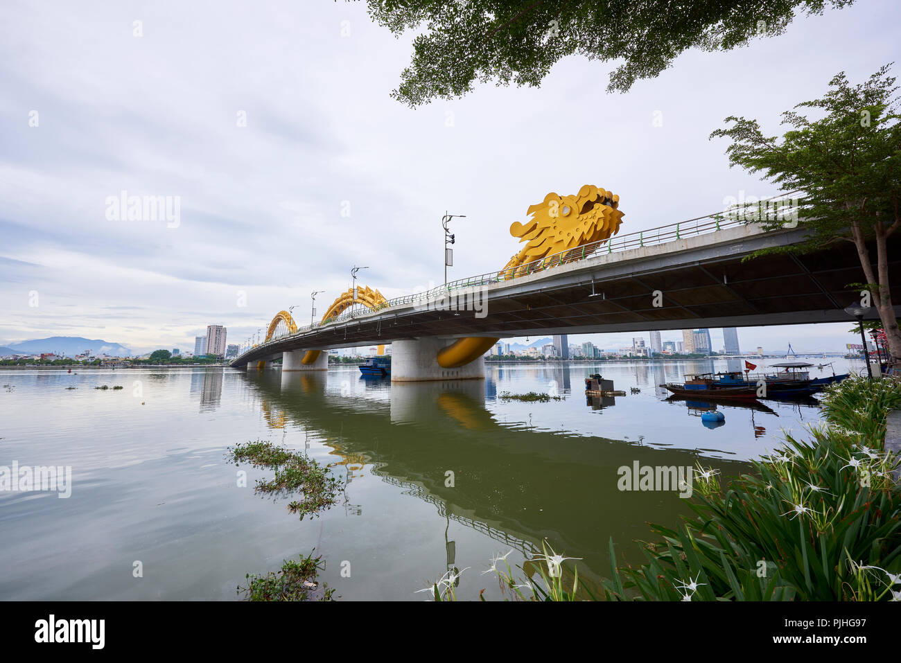 Dragon Bridge in Da Nang, Vietnam. The dragon's head spews out flames ...