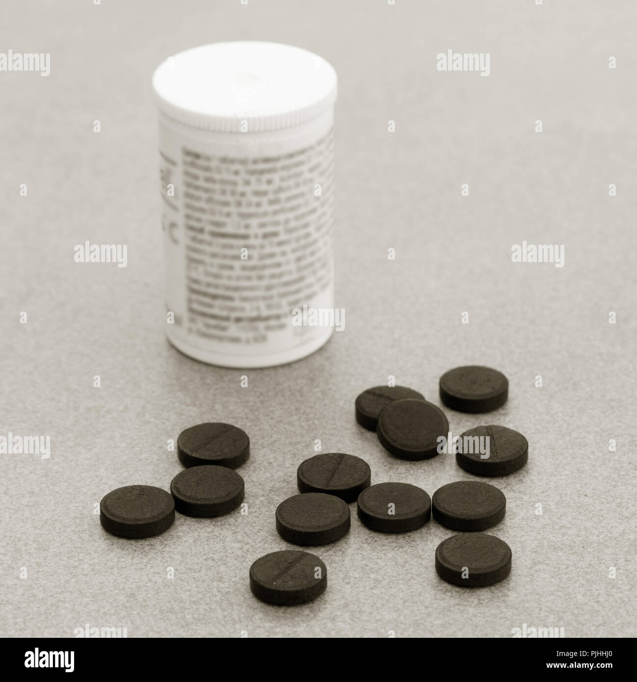 Activated Charcoal Tablets For Cleansing The Body On A Gray Background ...