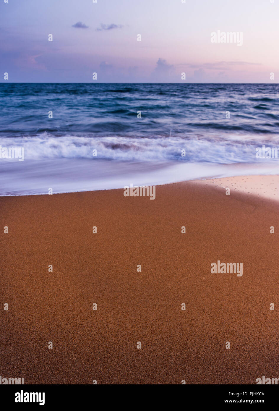 Simple beach sunset shot in long exposure.Copy space Stock Photo - Alamy