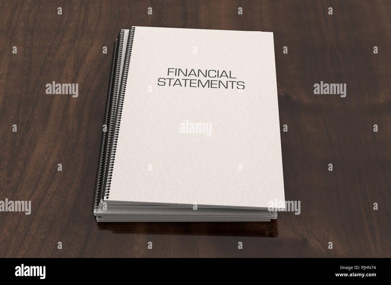 A pile of wire bound financial statement documents in a pile on a ...