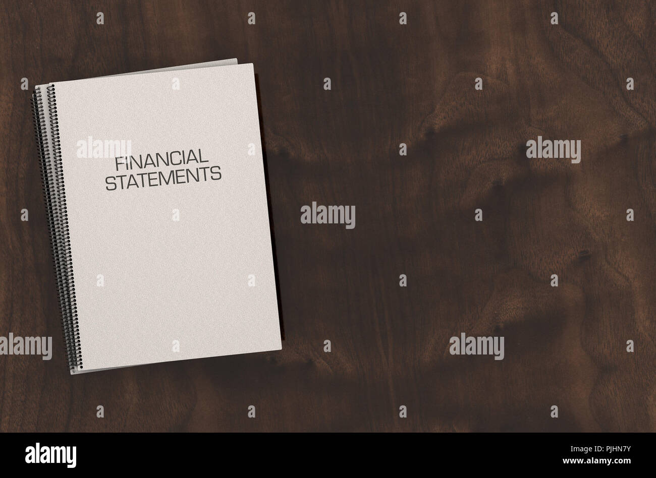 A pile of wire bound financial statement documents in a pile on a ...