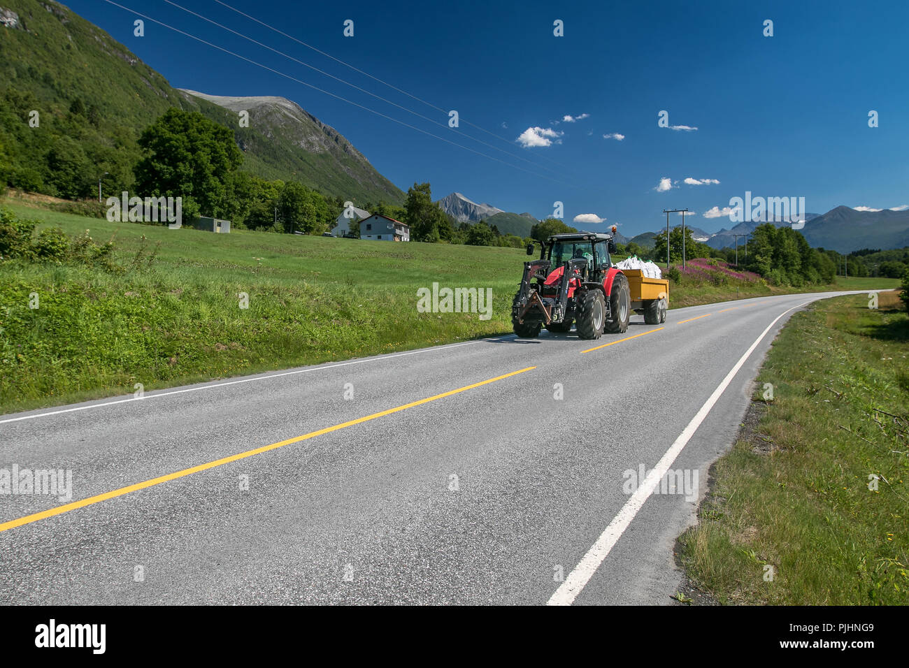 Tractor with loaded trailer hi-res stock photography and images - Alamy