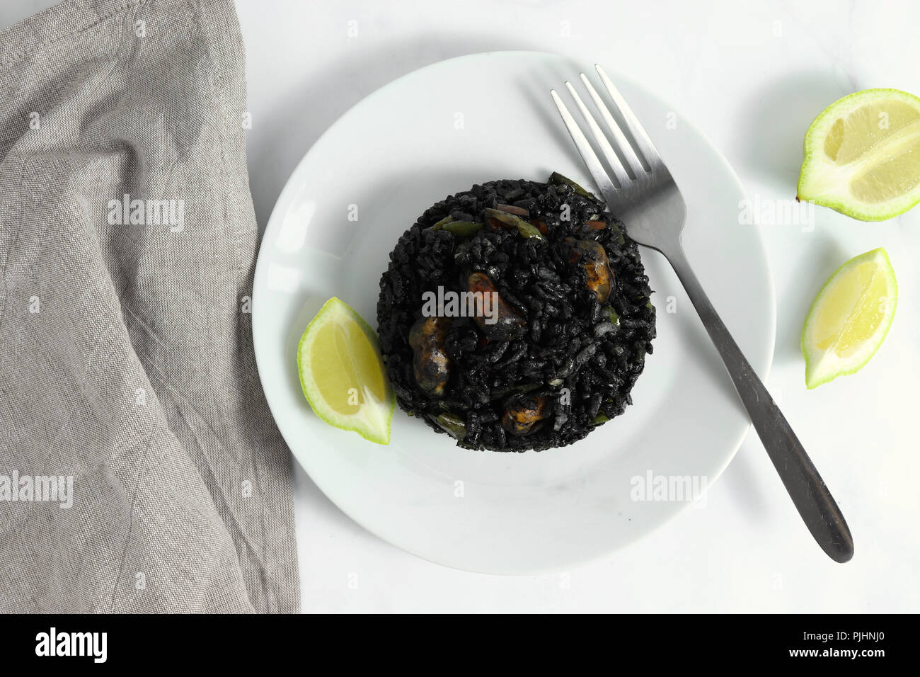 Traditional arroz negro - arròs negre - black rice dish, typical for ...