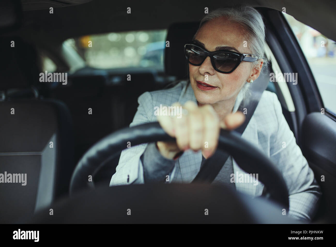 Old person driving hi-res stock photography and images - Alamy