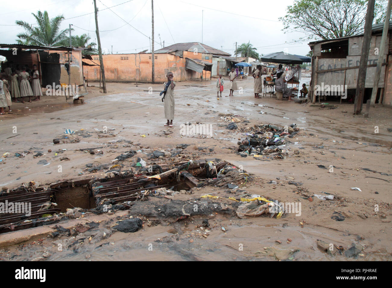 Flow in a street in a poor neighborhood. Lome. Togo Stock Photo - Alamy
