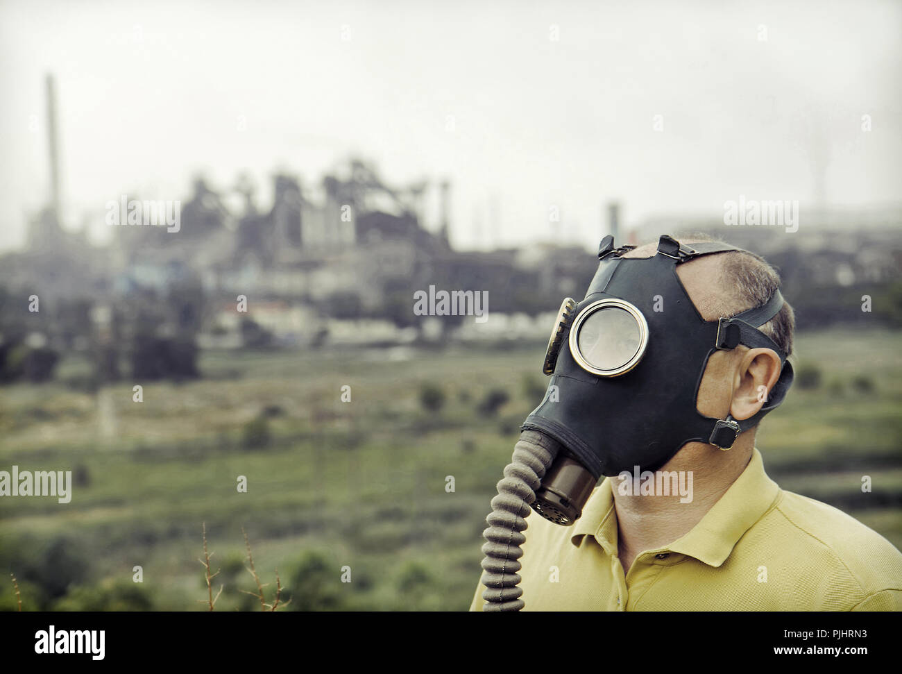 Men wearing gas mask on industrial factory background. Retro style ...