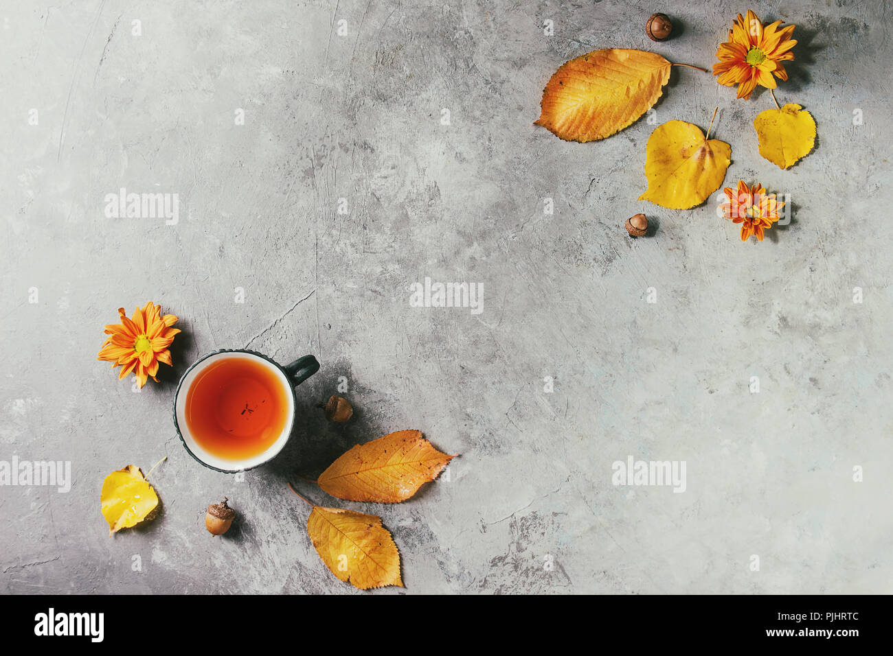 Cup of tea with autumn leaves Stock Photo - Alamy