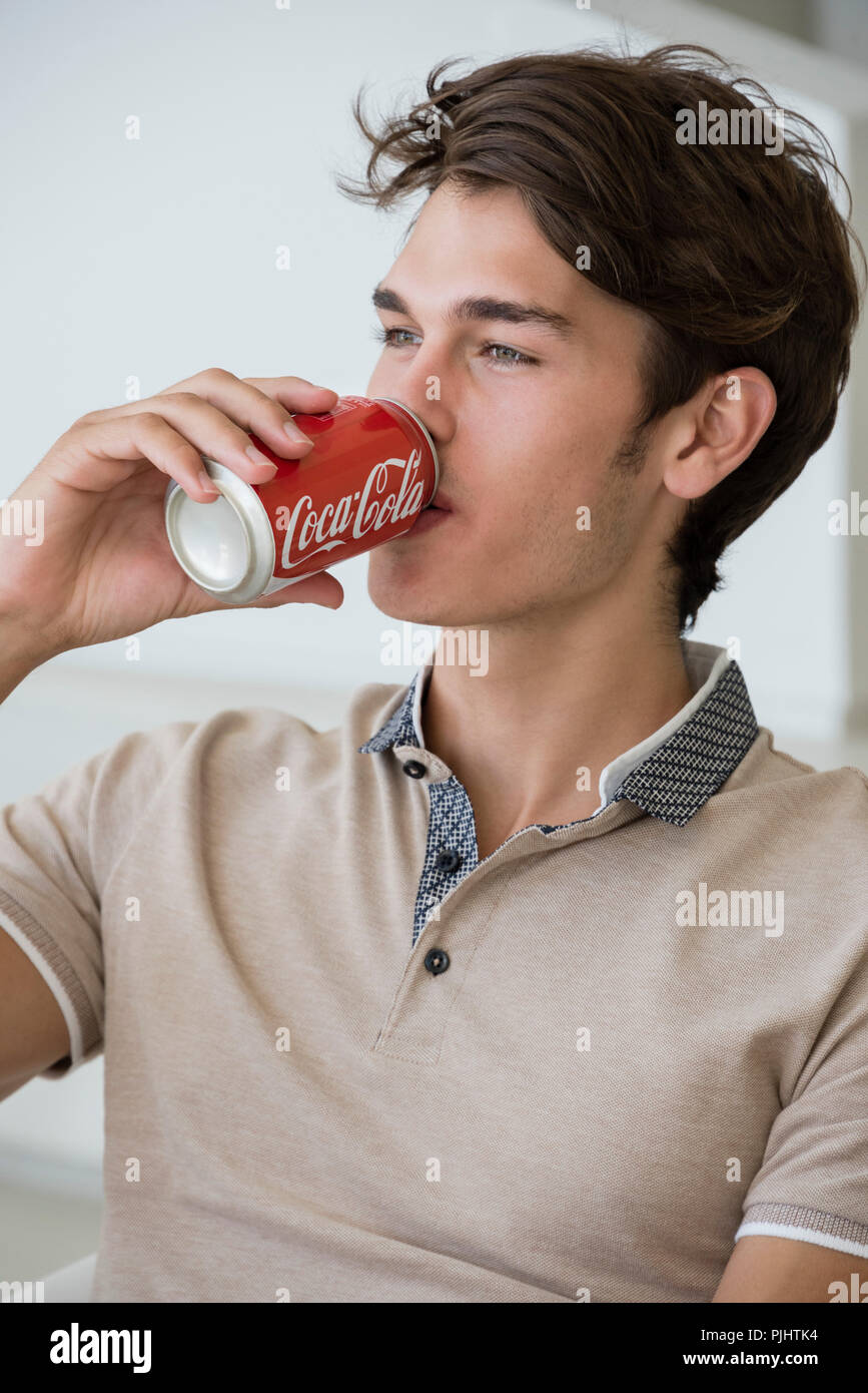 Teenager drink a coke Stock Photo - Alamy