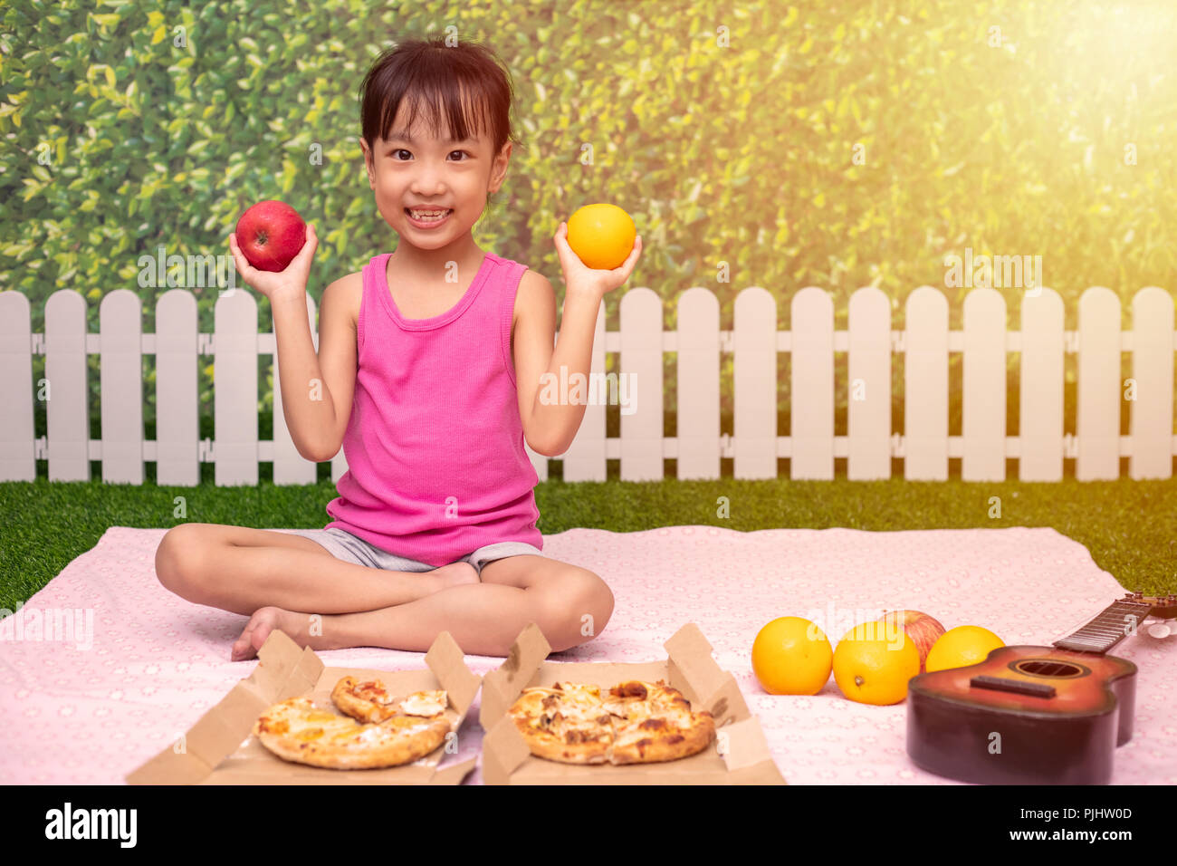 Asian Chinese little girl having picnic at outdoor garden Stock Photo ...