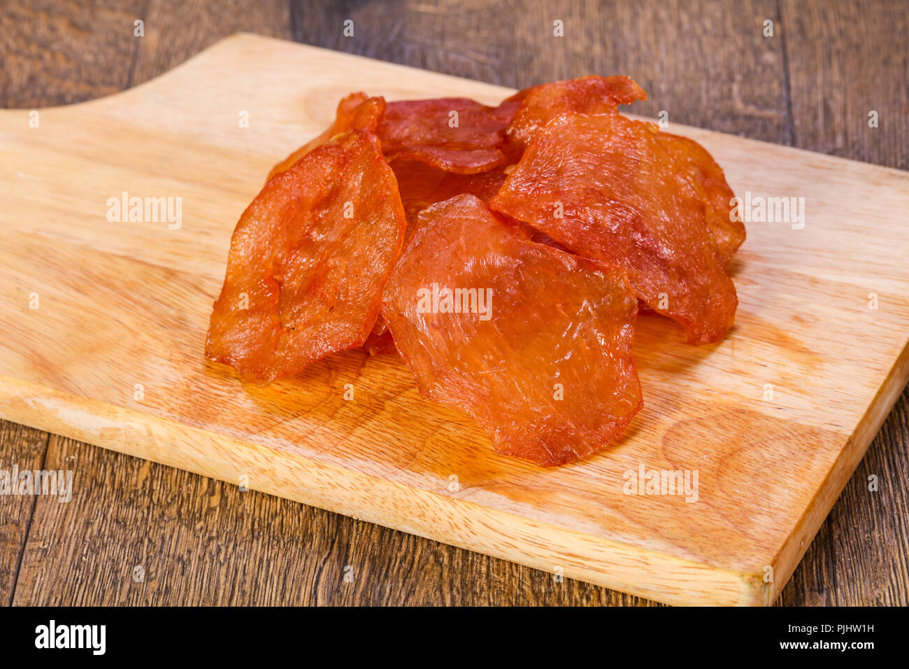 Dry chicken meat over wooden Stock Photo - Alamy